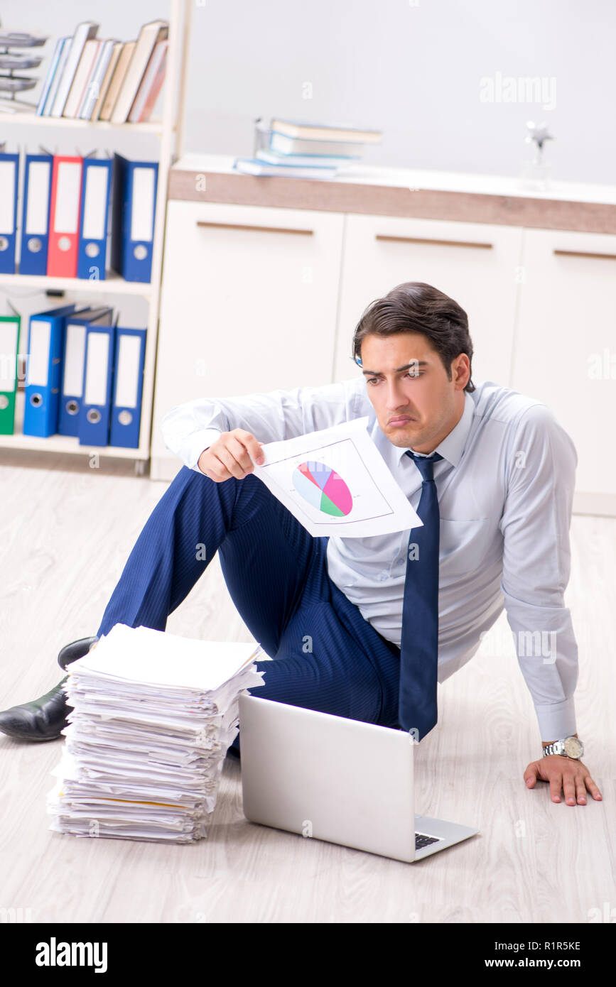 Extremely busy employee working in the office Stock Photo - Alamy