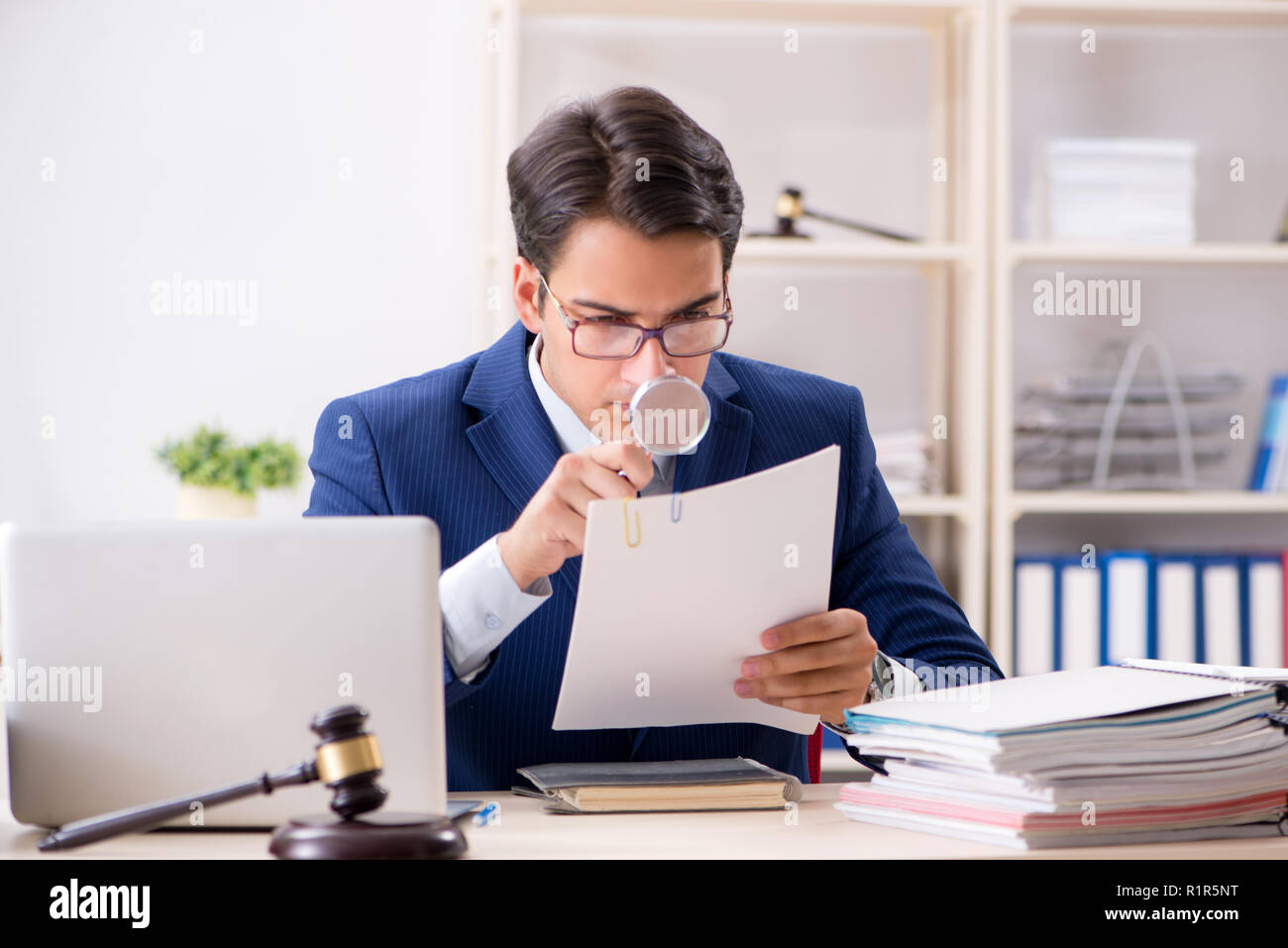 Young handsome judge working in court Stock Photo - Alamy