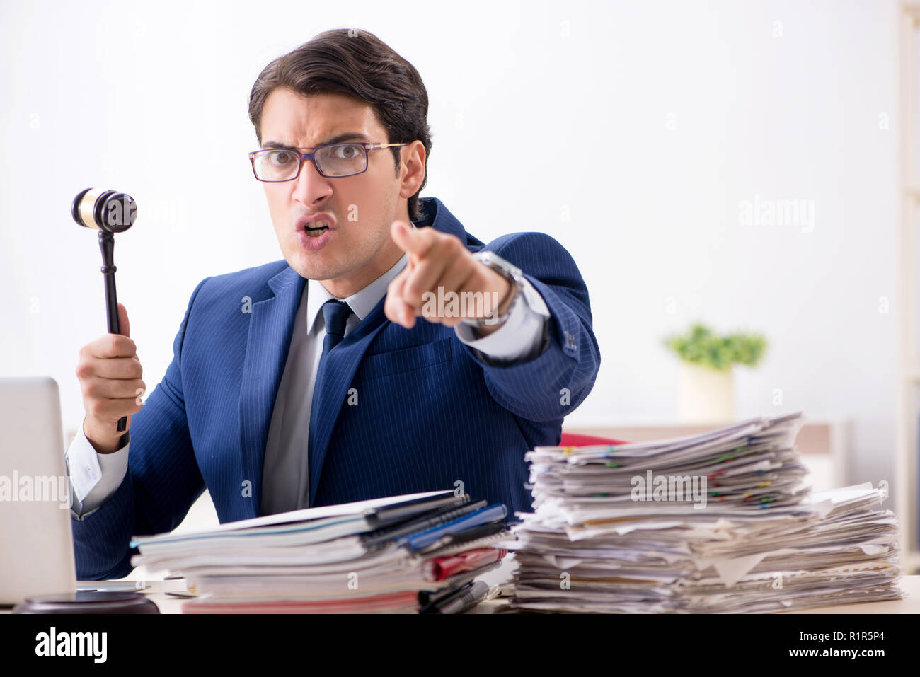 Young handsome judge working in court Stock Photo - Alamy