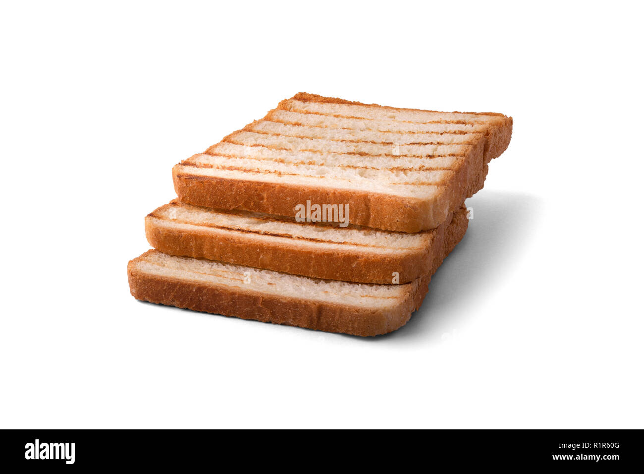 Slices of toast bread grilled with a golden crust isolated on white ...