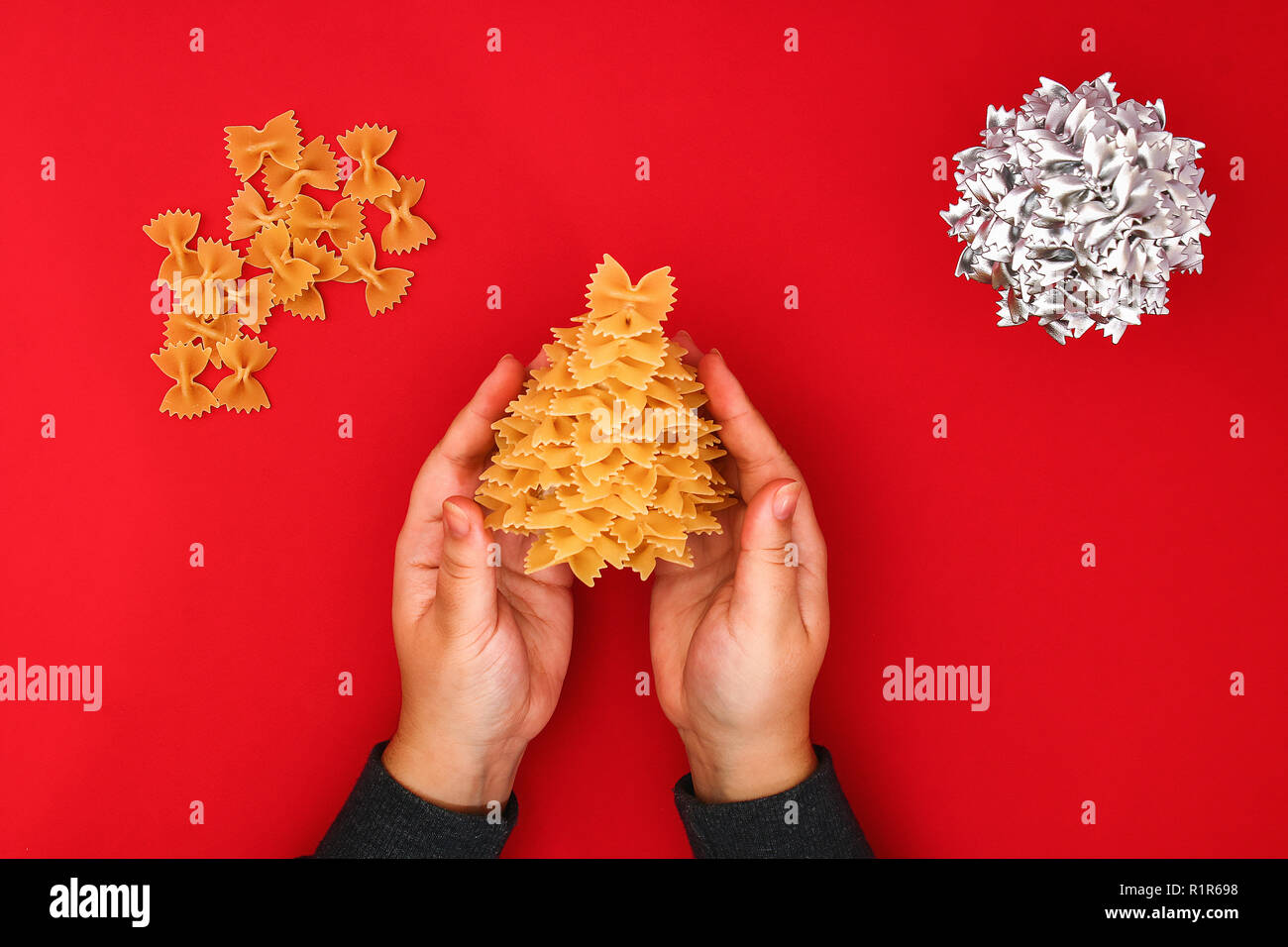 How to make a Christmas tree from raw pasta bows. The process of making ...