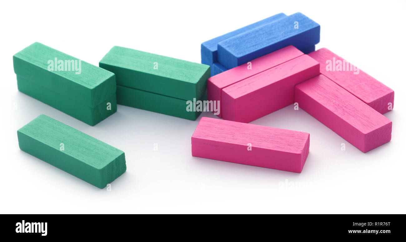 Jenga game of colorful wooden blocks over white background Stock Photo ...