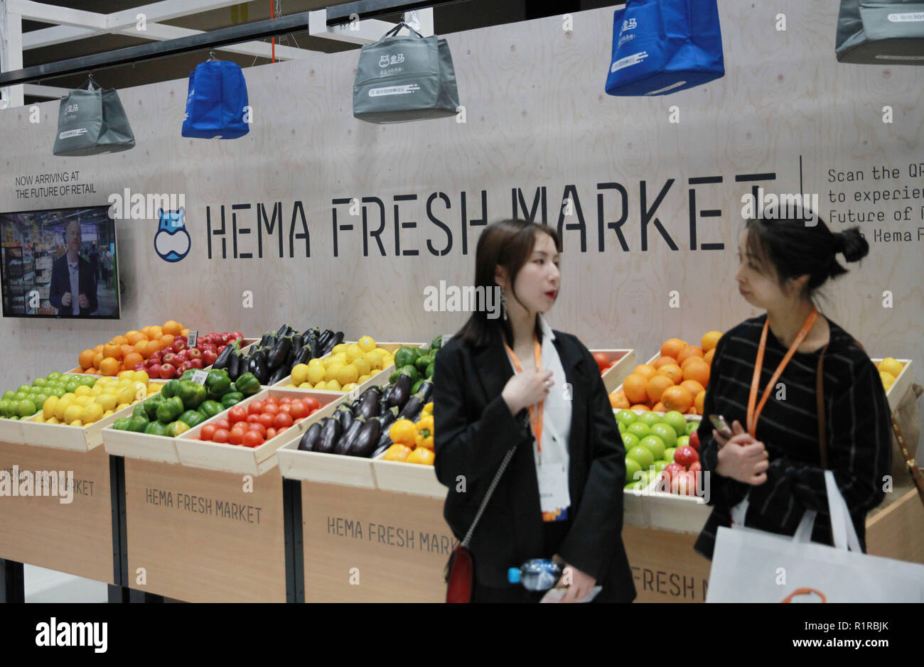 Beijing, Australia. 21st Sep, 2018. Women talk at the booth of Hema ...