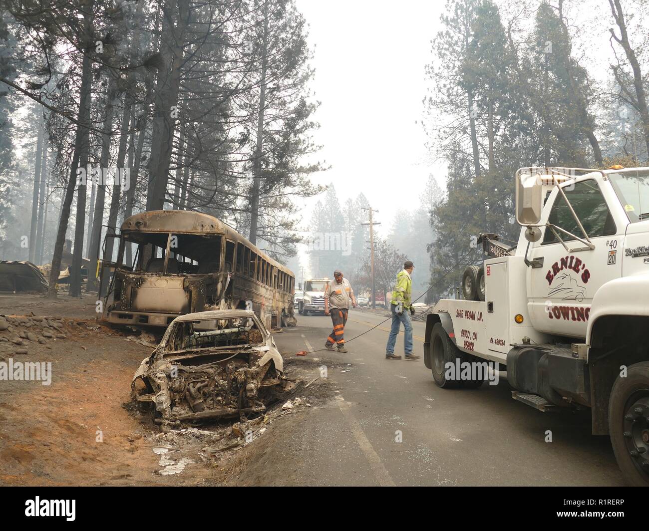 Paradise, USA. 13th Nov, 2018. Burnt out cars are removed from the ...