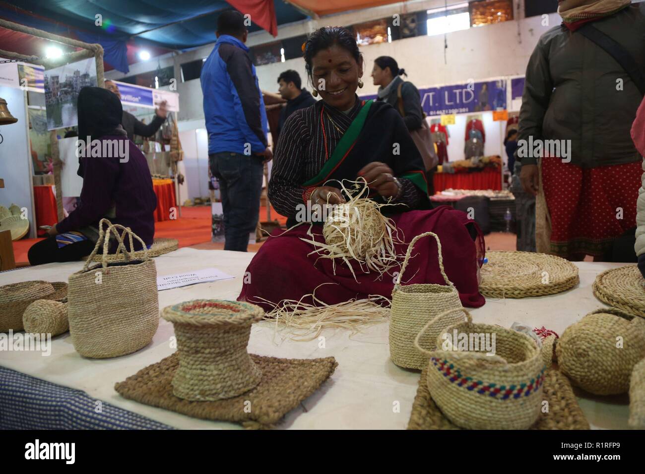 Kathmandu, Nepal. 14th Nov, 2018. A Nepali woman prepares traditional ...