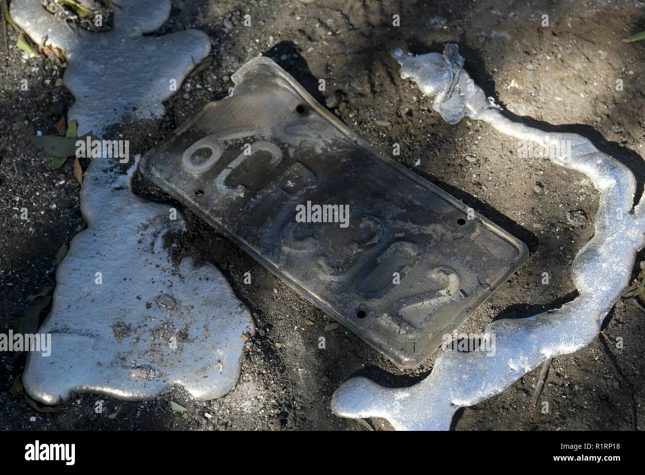 Los Angeles, California, USA. 14th Nov, 2018. A burned vehicle license ...