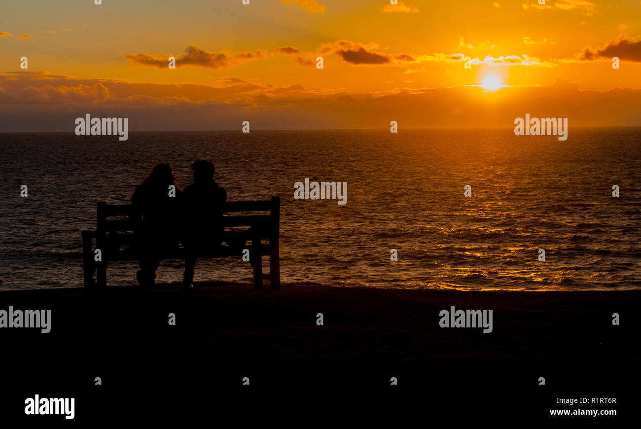 Silhouette family sitting on bench hi-res stock photography and images ...