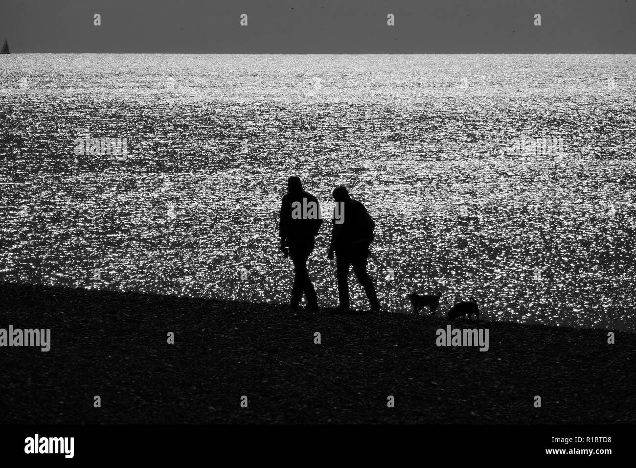 Silhouette Beach walk Stock Photo - Alamy