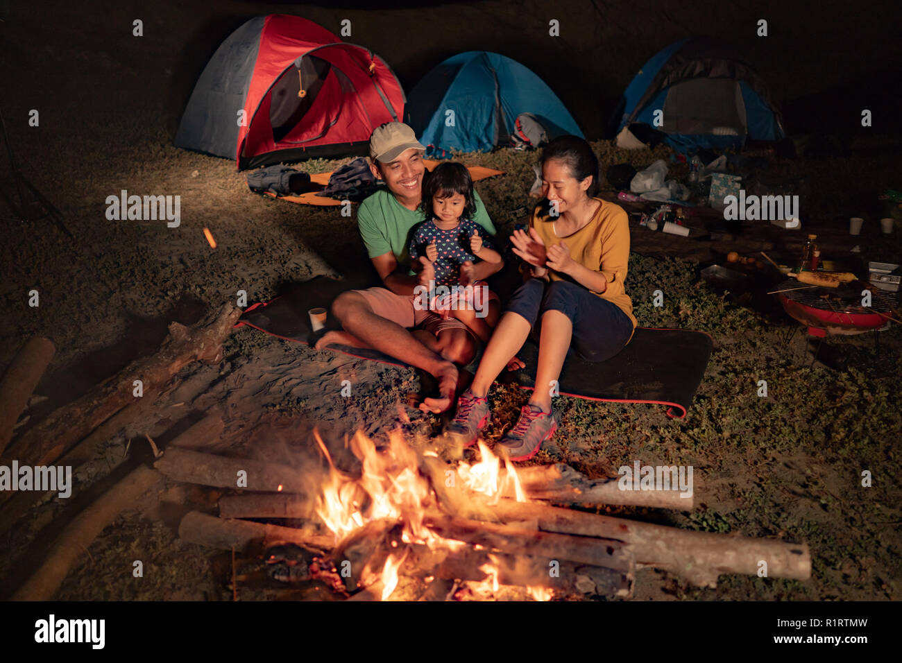 Family Around The Campfire