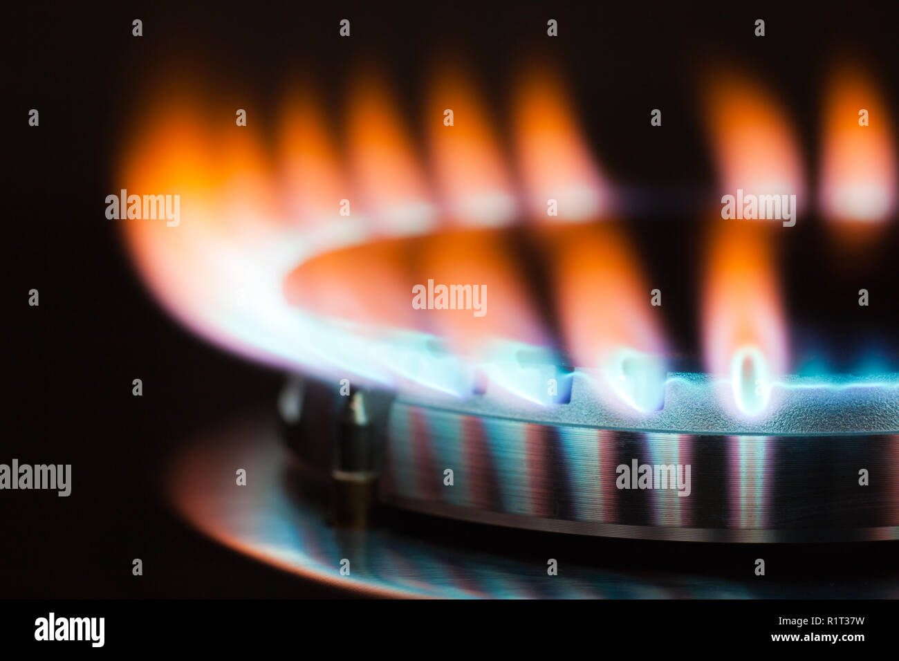 Gas burning in the burner of gas oven Stock Photo - Alamy