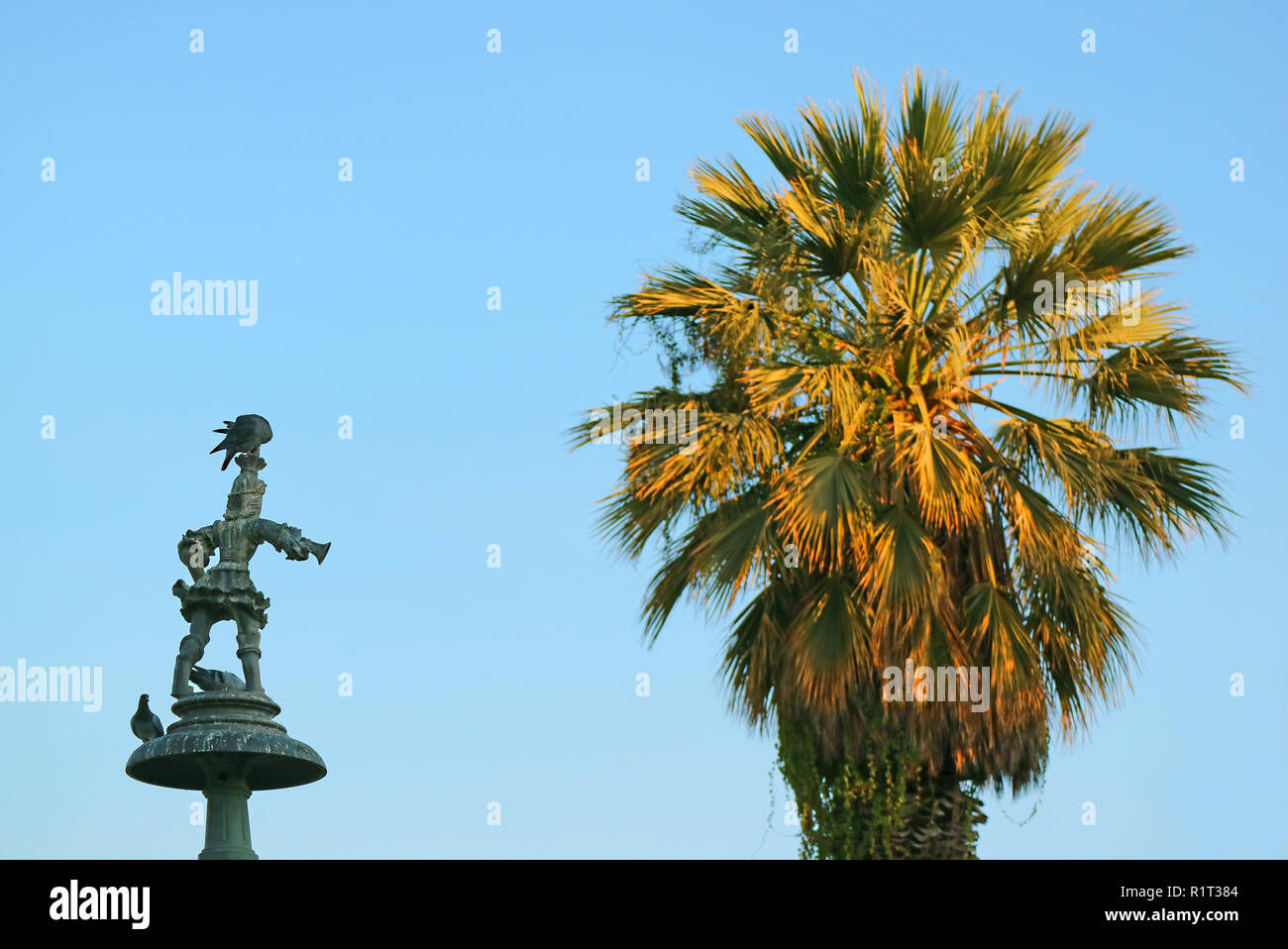 Sculpture of a soldier carrying a trumpet or Tuturutu on fountain top ...