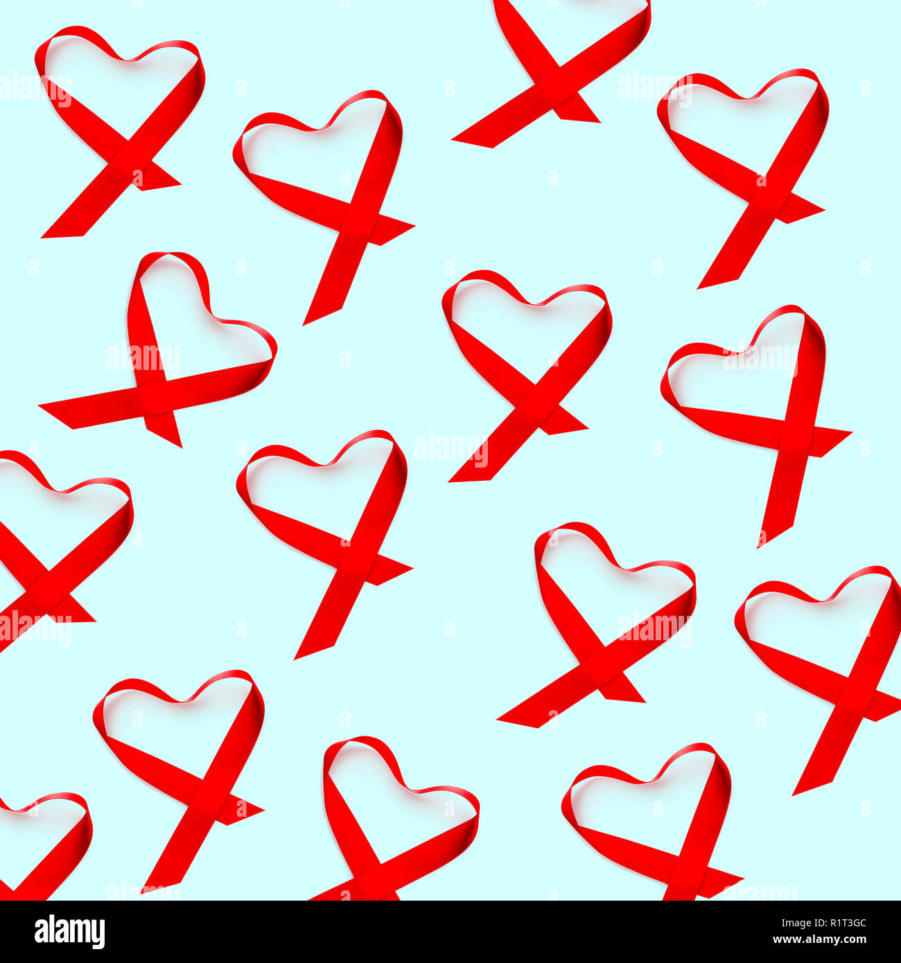 some red ribbons, for the fight against AIDS, placed as hearts, on a ...