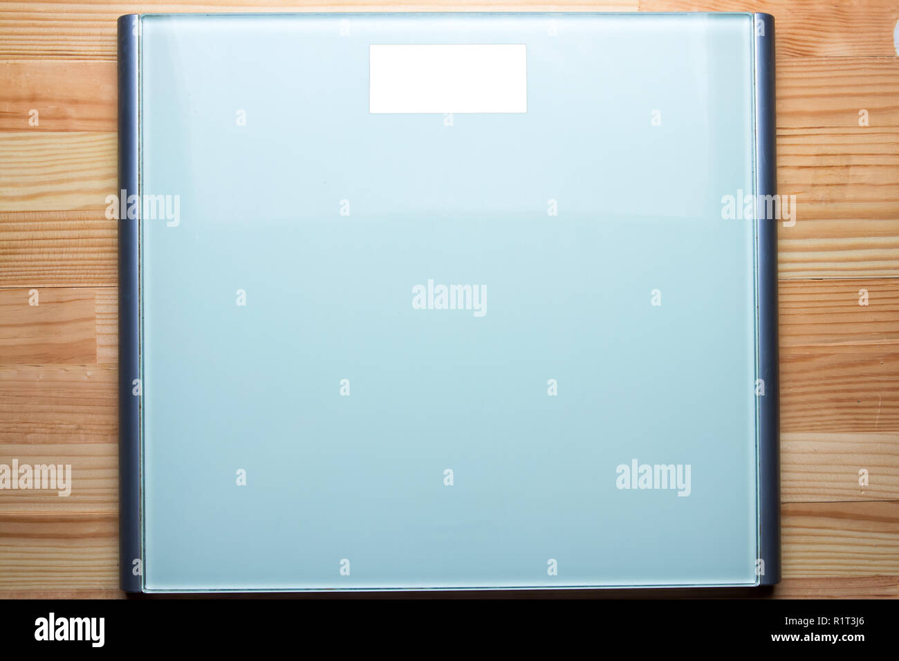 Bathroom weight scale on natural wooden table. Blank white screen ...