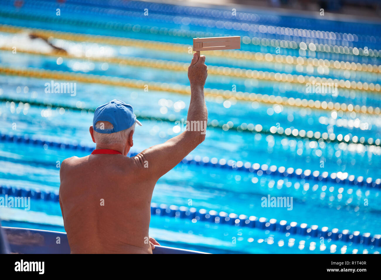 Senior emotional sports fan at swimming event Wild senior fan at ...