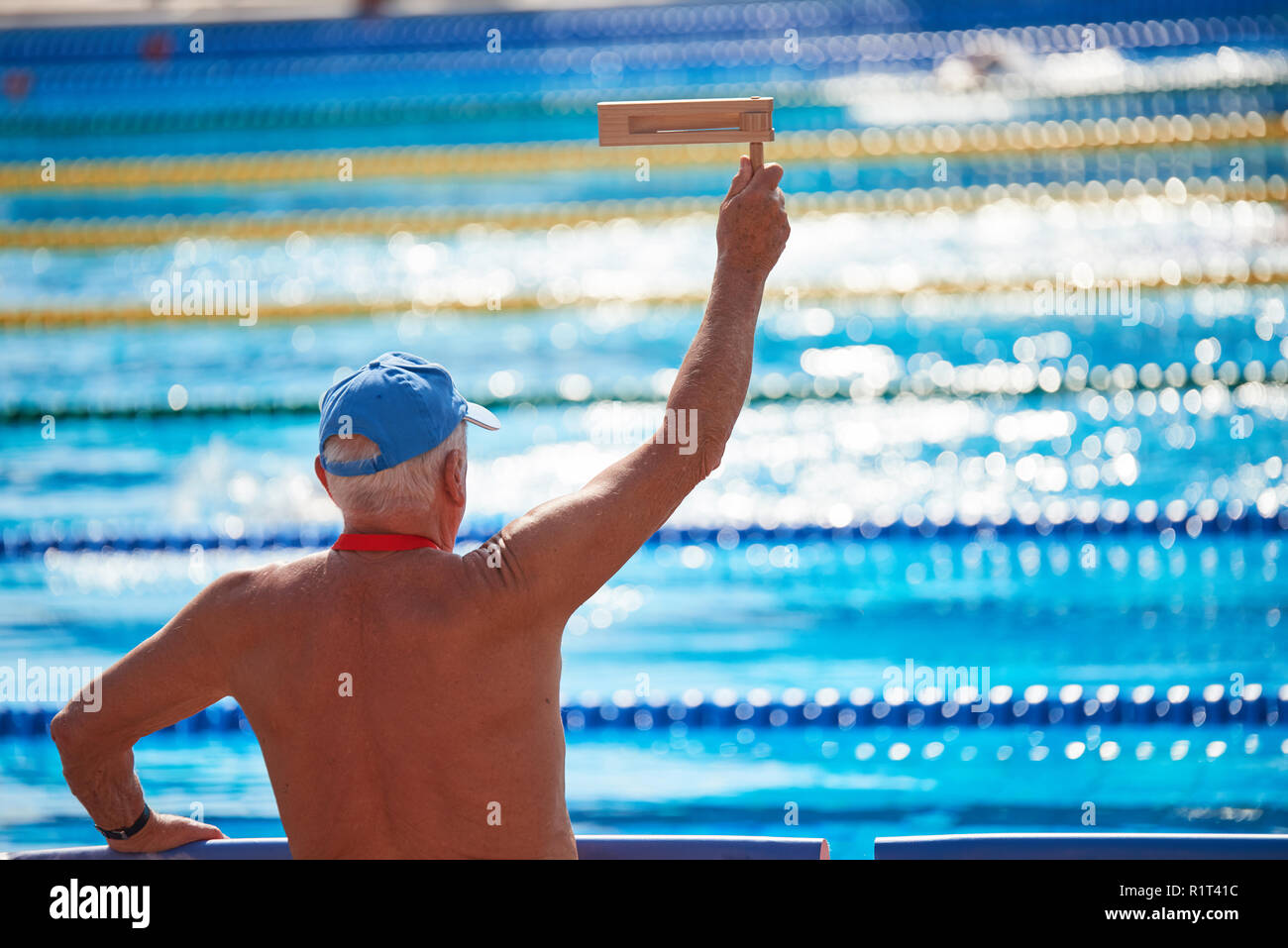 Senior emotional sports fan at swimming event Wild senior fan at ...