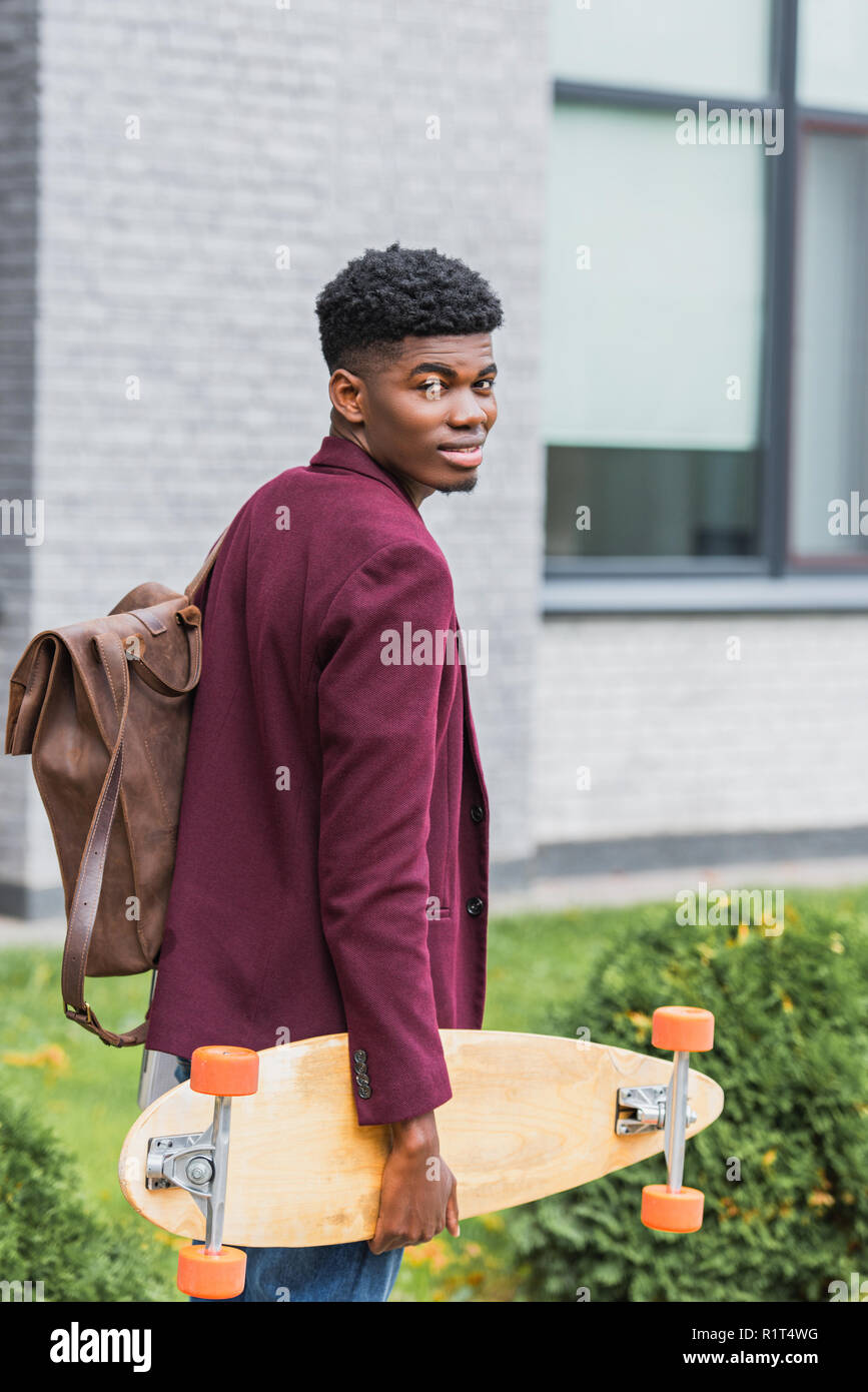 Student walking smiling black hi-res stock photography and images - Alamy