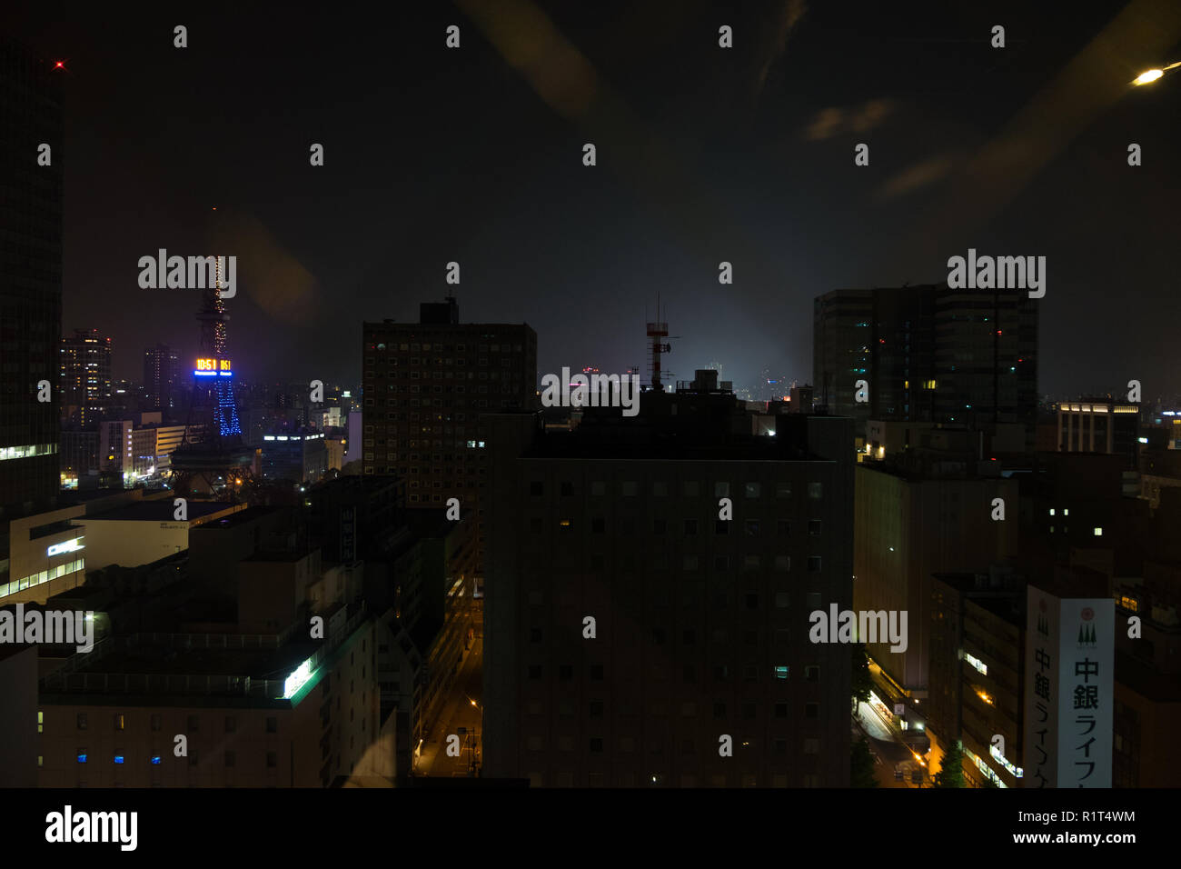 Sapporo at night, including a view of the lit TV tower Stock Photo - Alamy