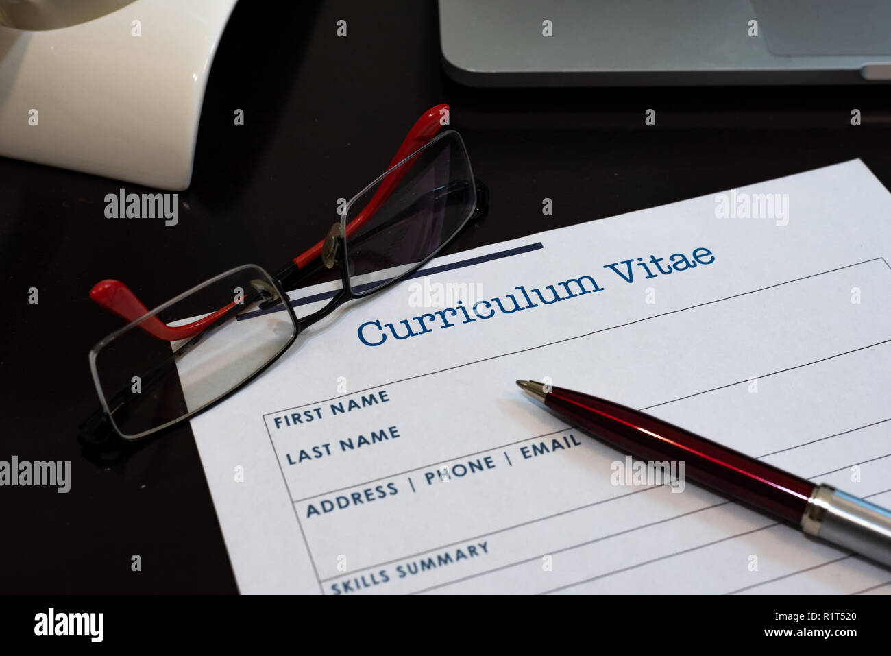 Writing curriculum vitae for job application Stock Photo - Alamy