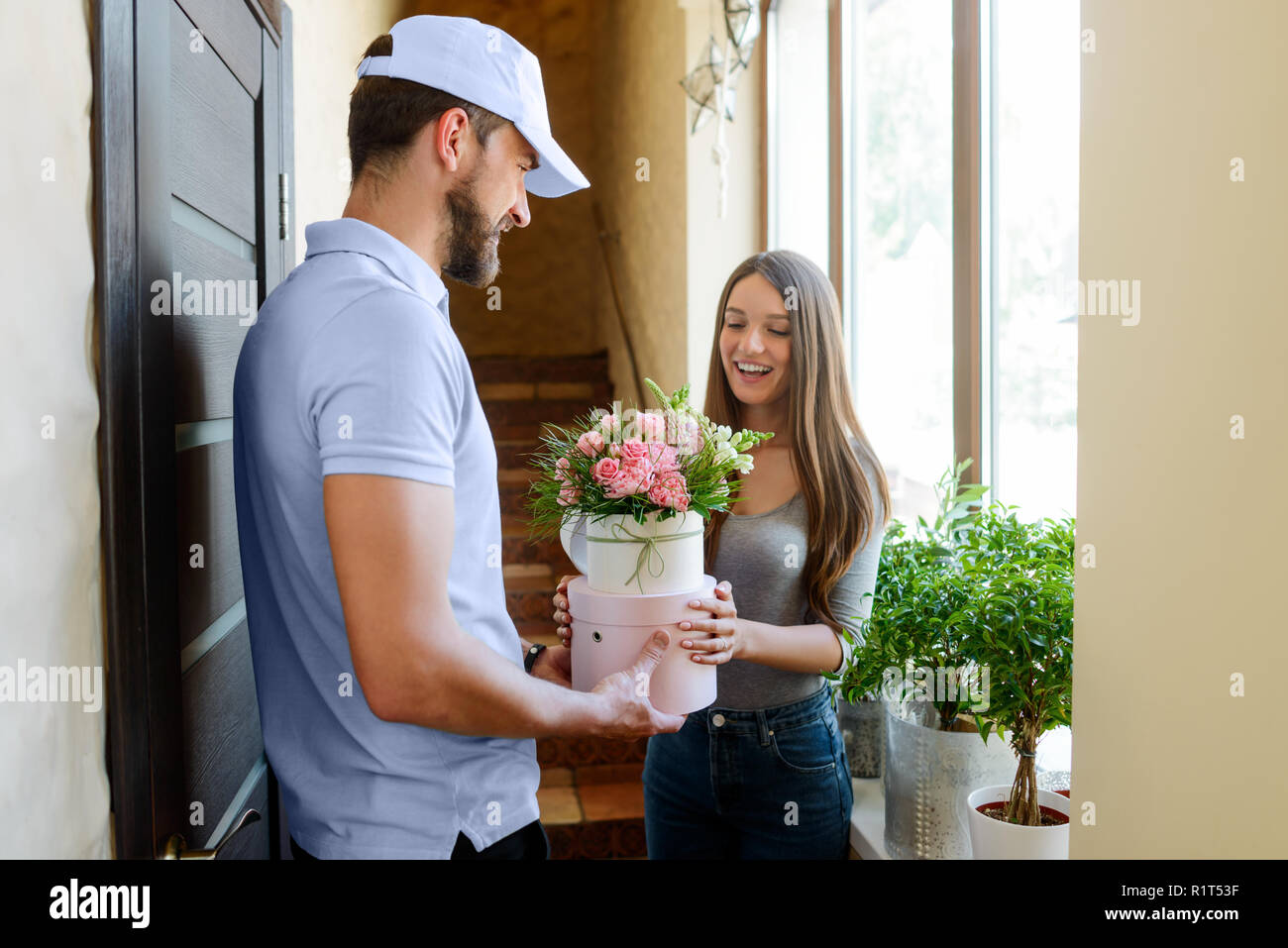 Male courier bouquet flowers hi-res stock photography and images - Alamy