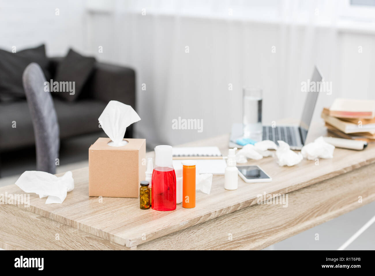 close-up shot of messy office workplace with laptop and various ...