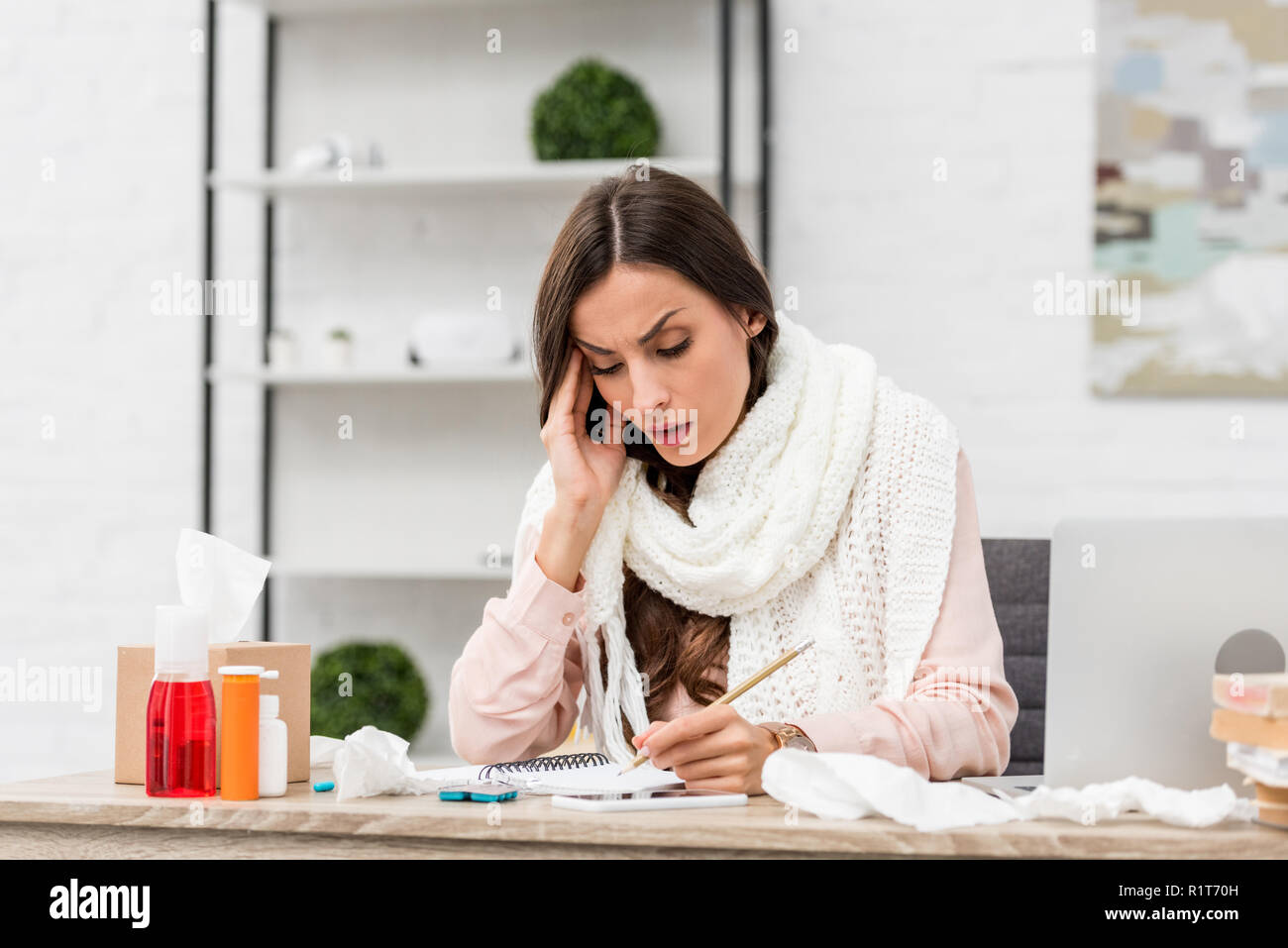 Sick businesswoman trying work hi-res stock photography and images - Alamy