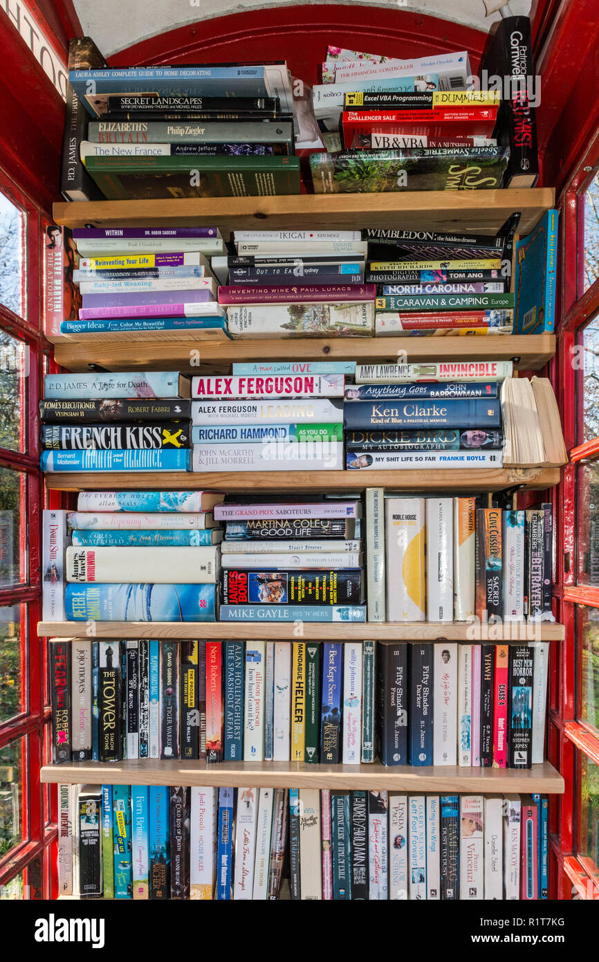Old-fashioned red telephone box or kiosk now used as a library, UK ...