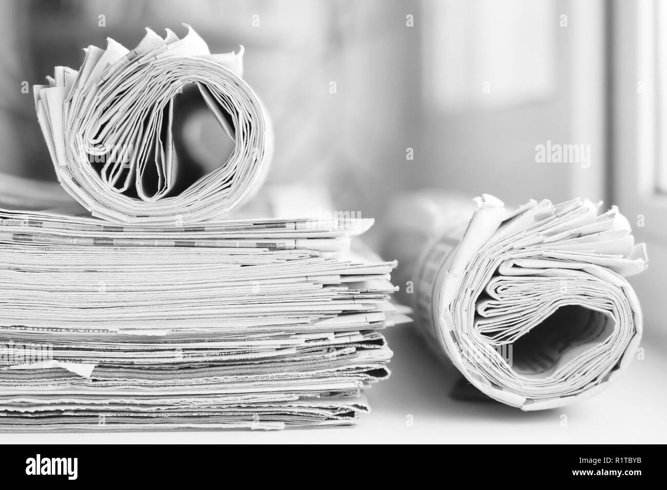 Newspapers on table Black and White Stock Photos & Images - Alamy