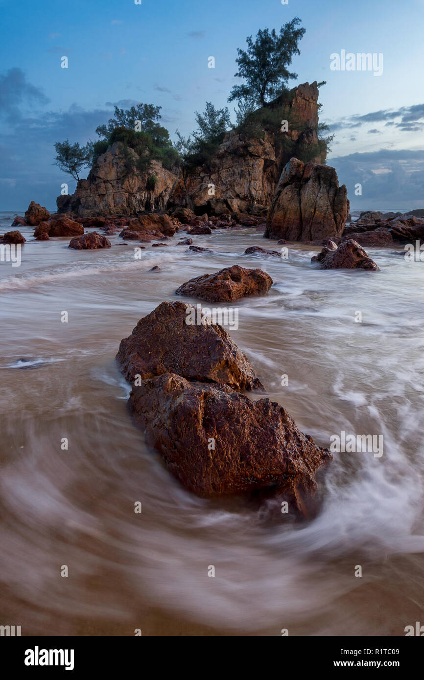 Sea stacks during sunrise with waves crashing the beach Stock Photo - Alamy