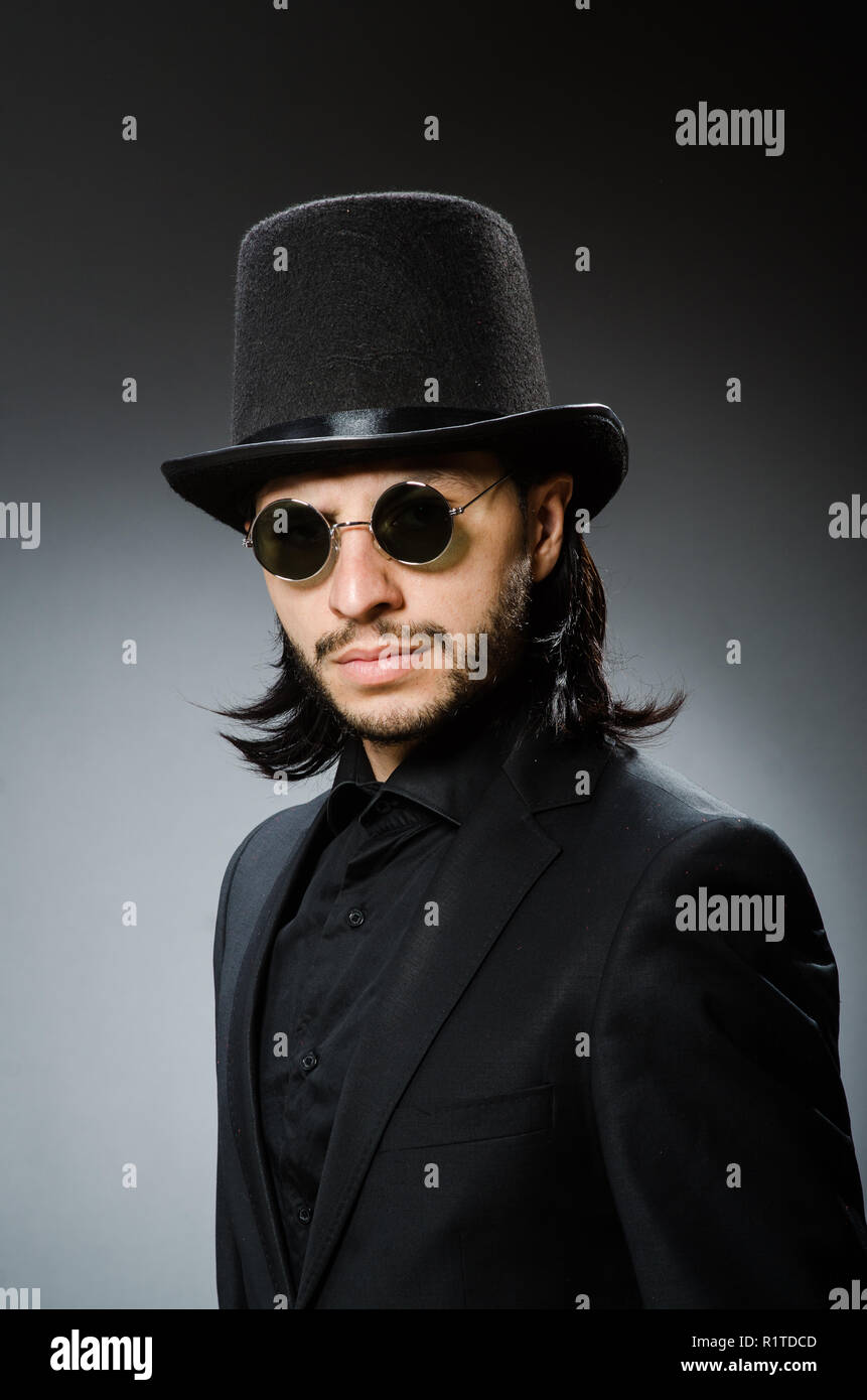 Vintage concept with man wearing black top hat Stock Photo - Alamy