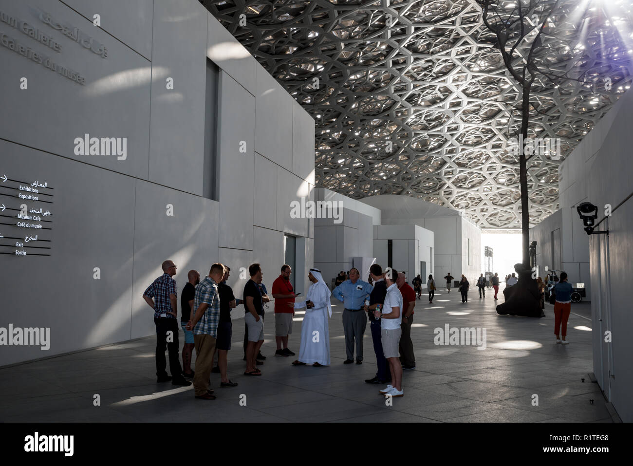 Tourists are being guided inside Louvre Abu Dhabi, UAE Stock Photo - Alamy