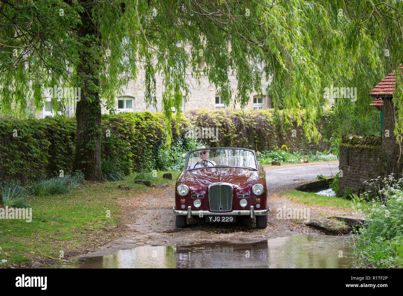 Motorist driving 1961 British made Alvis TD21 DHC drophead ooupe ...
