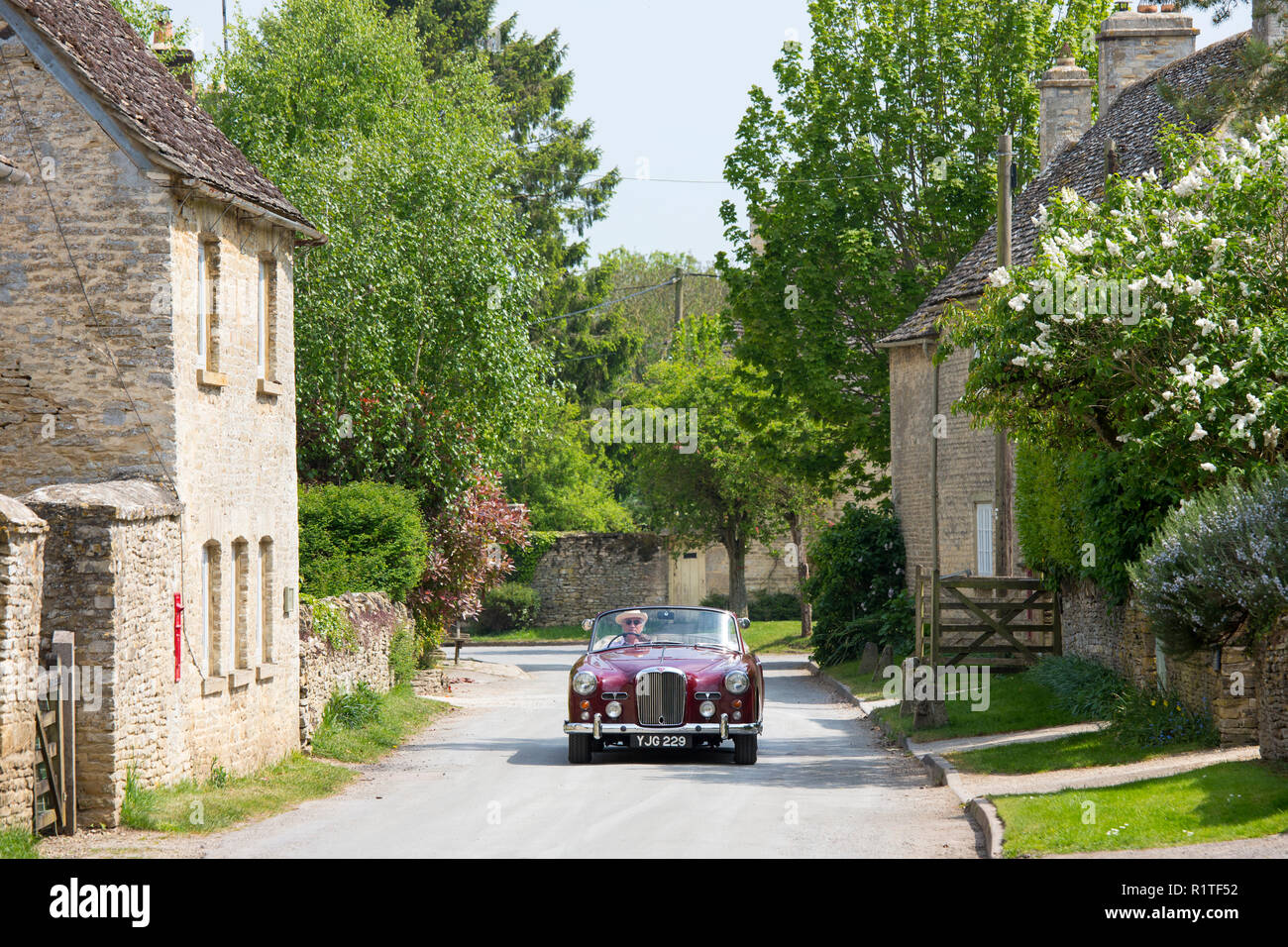 Motorist driving 1961 British made Alvis TD21 drophead ooupe classic ...