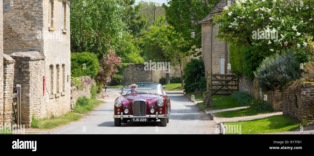 Motorist driving 1961 British made Alvis TD21 drophead ooupe classic ...
