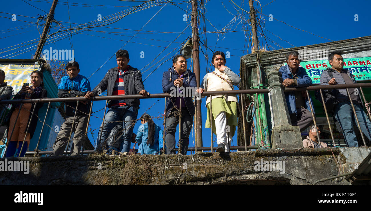 Low angle view of people standing against railing, Darjeeling, West ...