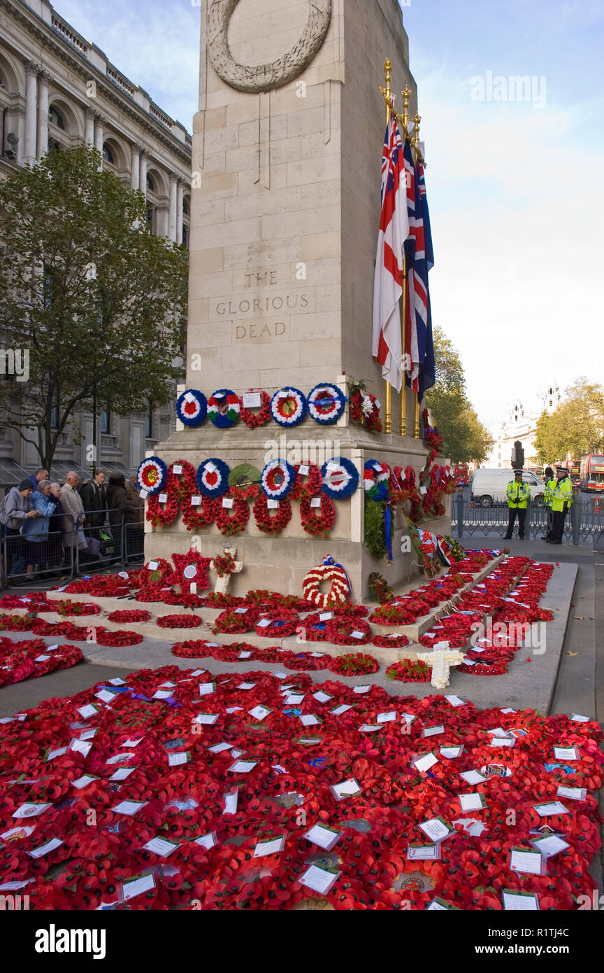 Poppy wreaths surround the Cenotaph, a 1920 war memorial on Whitehall ...