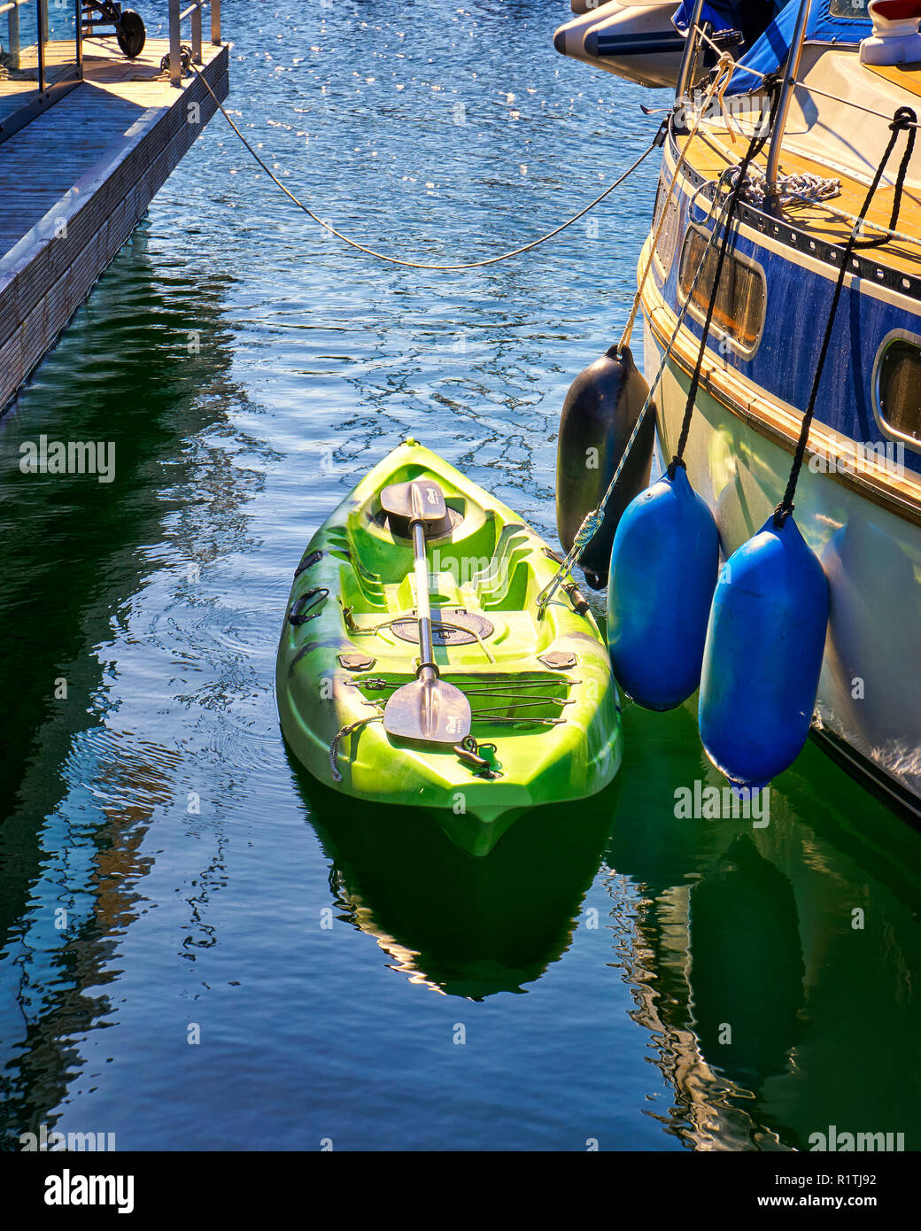 Small dinghy on sailboat in the harbor in Boltenhagen. Germany Stock ...
