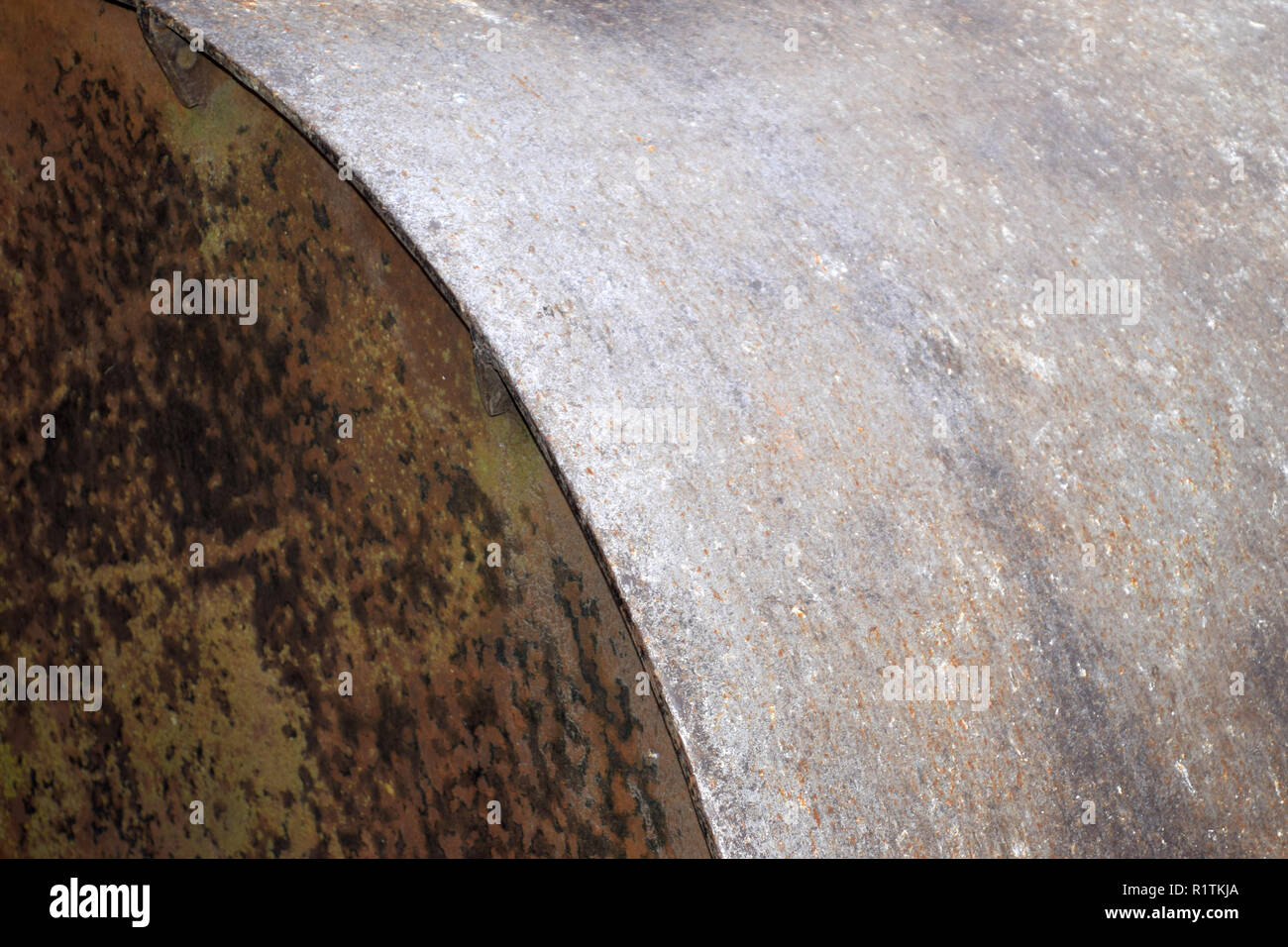 marco shot of a small part side view of a metal farm roller, old and ...
