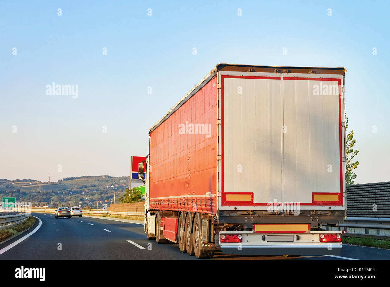 Red Truck in the alphalt road of Poland. Lorry transport delivering ...