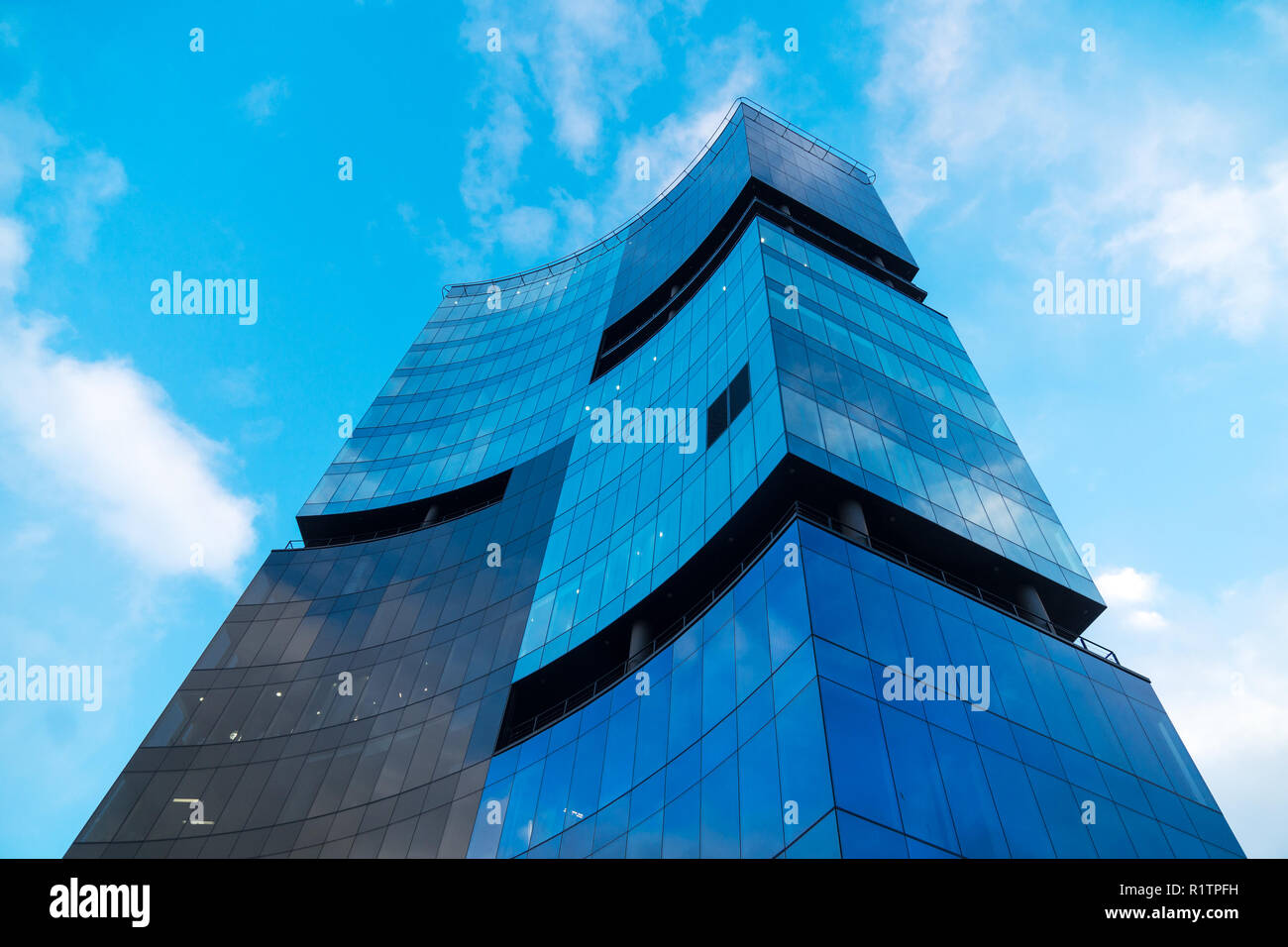 Modern round office building with windows Stock Photo - Alamy