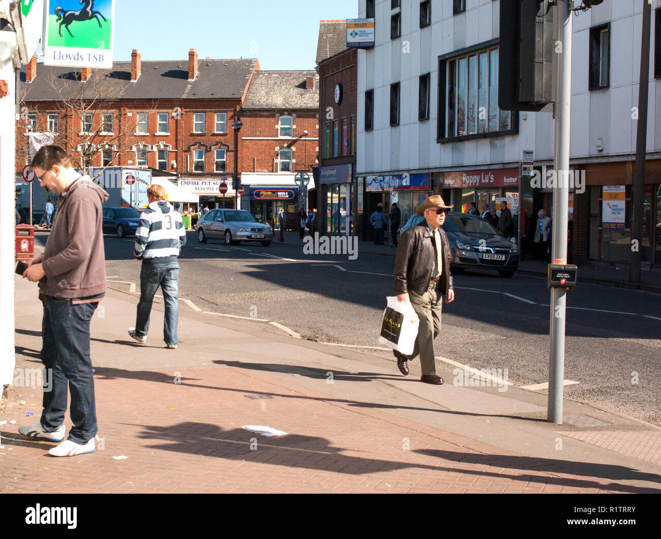 People walking on a town pavement Stock Photo - Alamy
