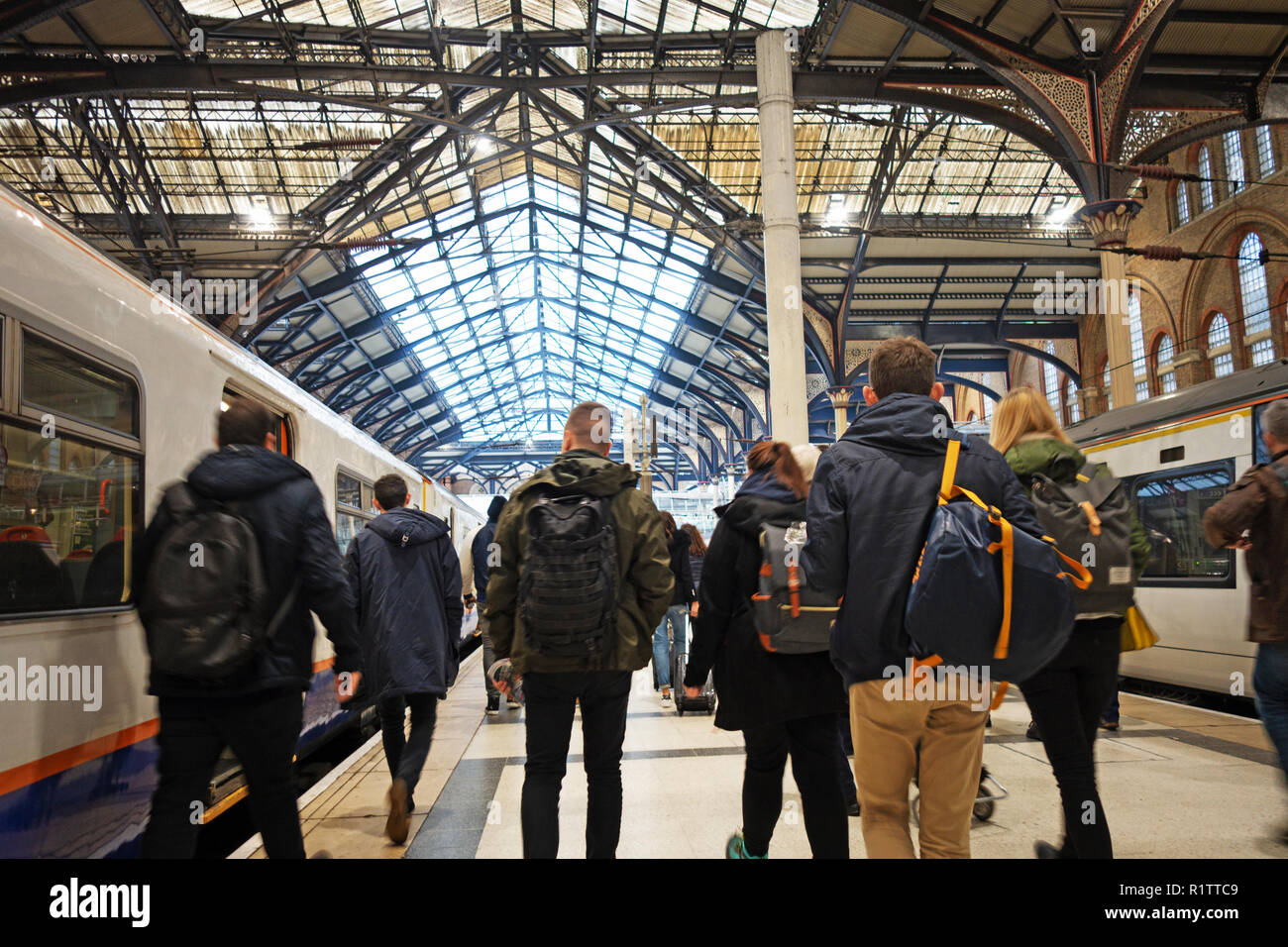 Passengers arrive on a train into London Liverpool Station Stock Photo ...