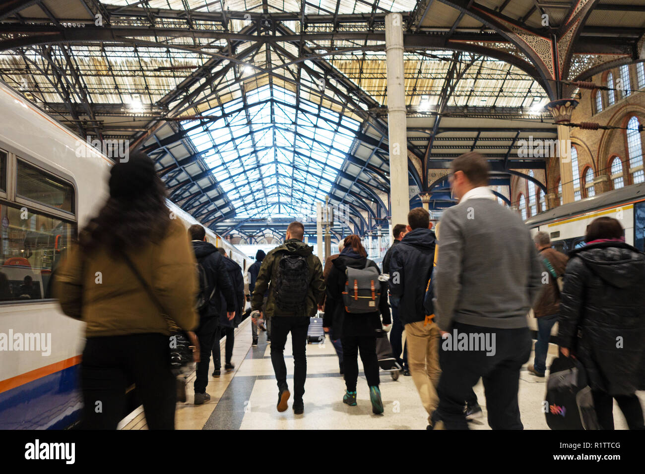Passengers arrive on a train into London Liverpool Station Stock Photo ...