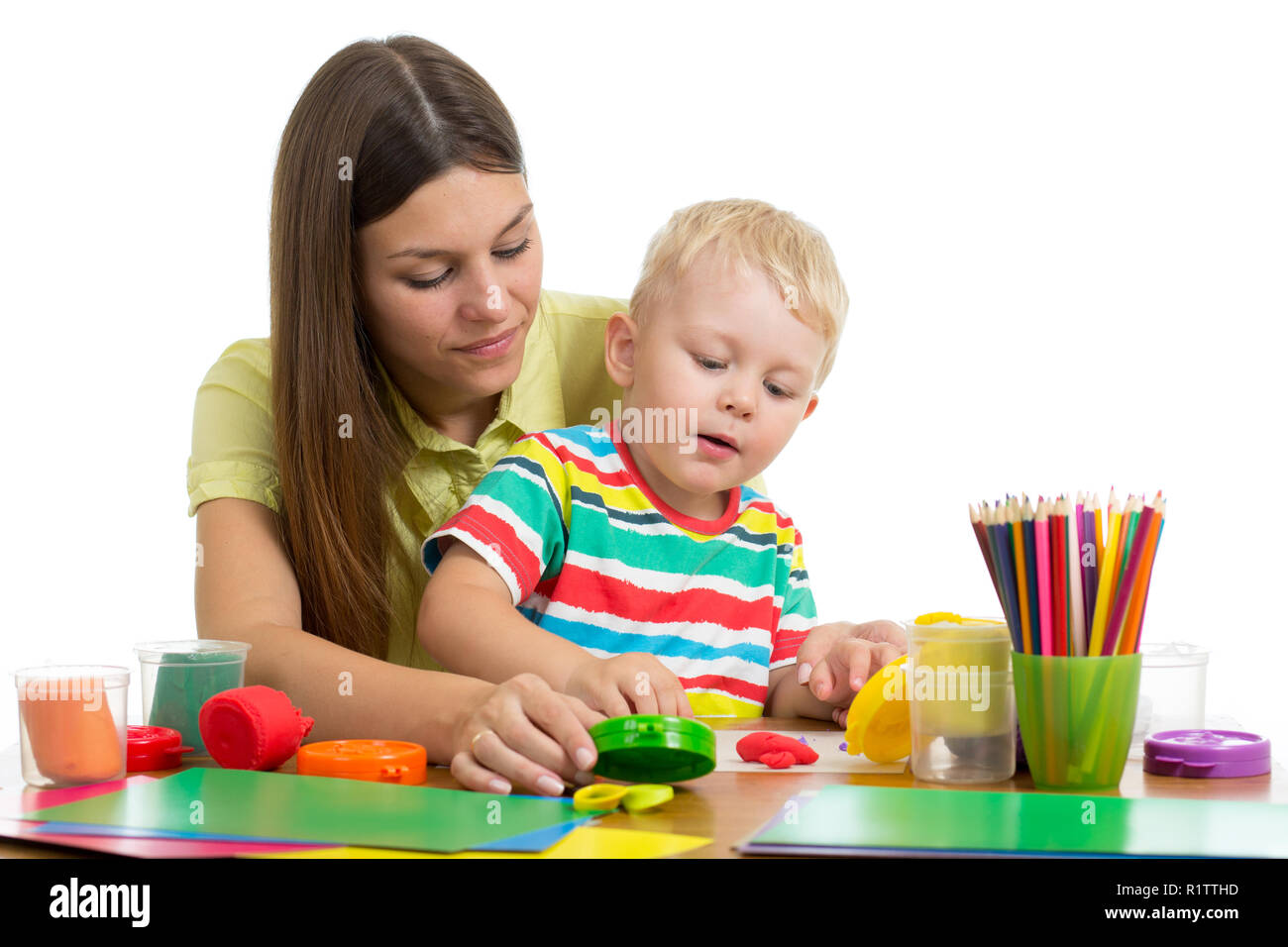 Parent and child plasticine modeling together isolated on white ...
