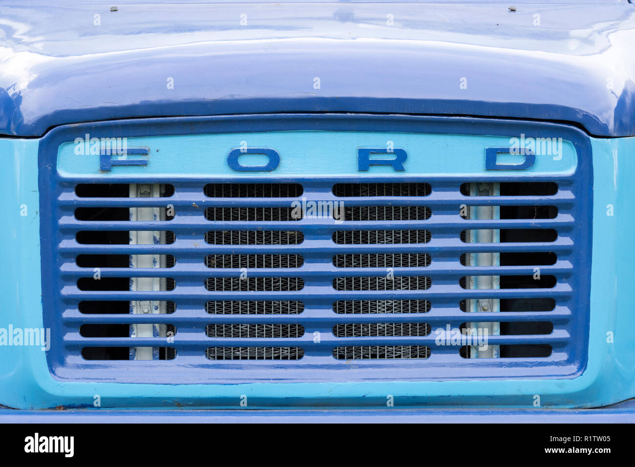Two tone blue painted radiator grille of an old classic First ...