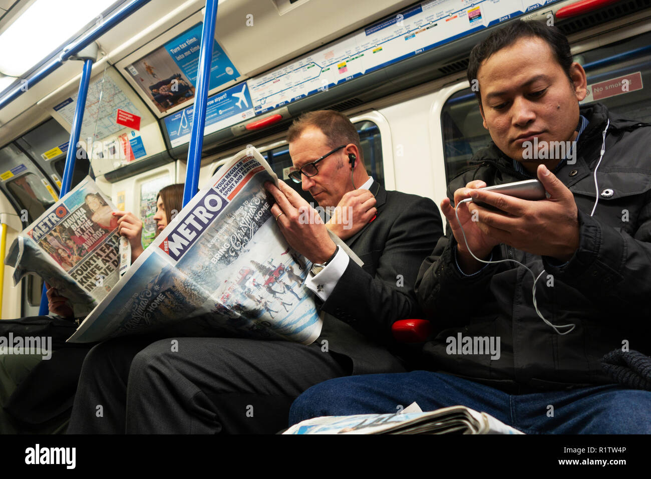 Tube commuters time, Commuters reading and using smartphones and london ...