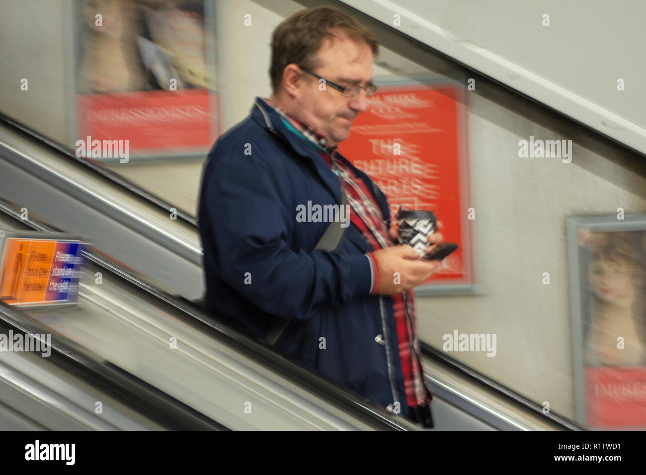 Tube commuters time, London male commuter travelling down the ...