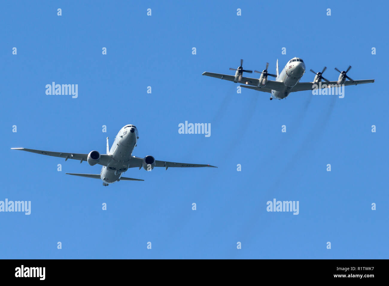 A Lockheed P-3 Orion flies in formation with its succesor the Boeing P ...
