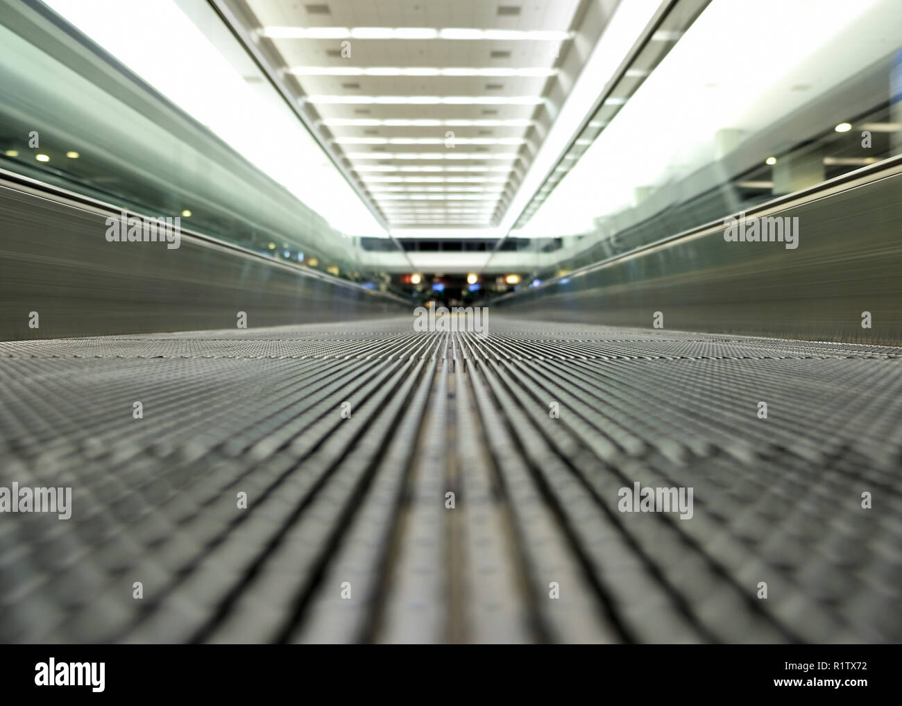 Ground level view of an empty moving walkway at an airport ...