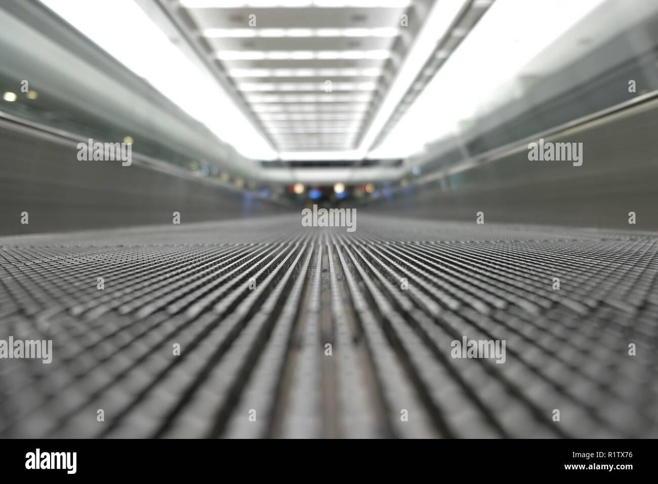 Ground level view of an empty moving walkway at an airport ...