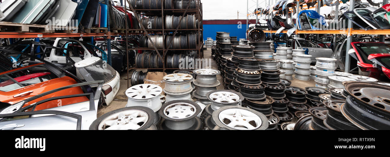 Auto parts market. Car wheels are on the ground Stock Photo - Alamy